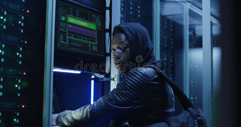 Black Man Hacking Computer System in Server Room Stock Photo - Image of ...