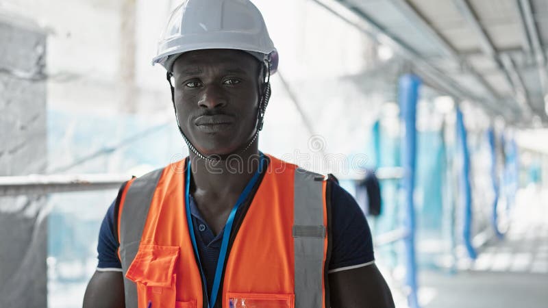 African American Man Builder Standing with Serious Face at Construction ...