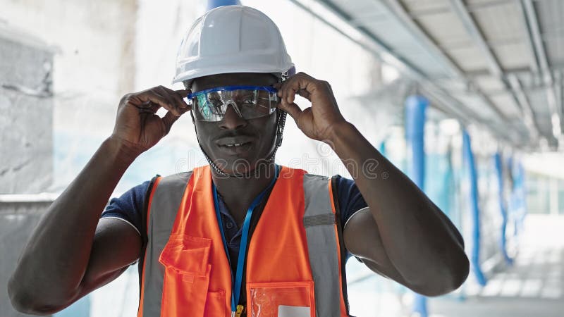 African American Man Builder Standing with Serious Face at Construction ...