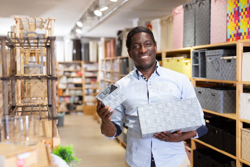 African American Man Chooses Laundry Box in Store Stock Image - Image ...