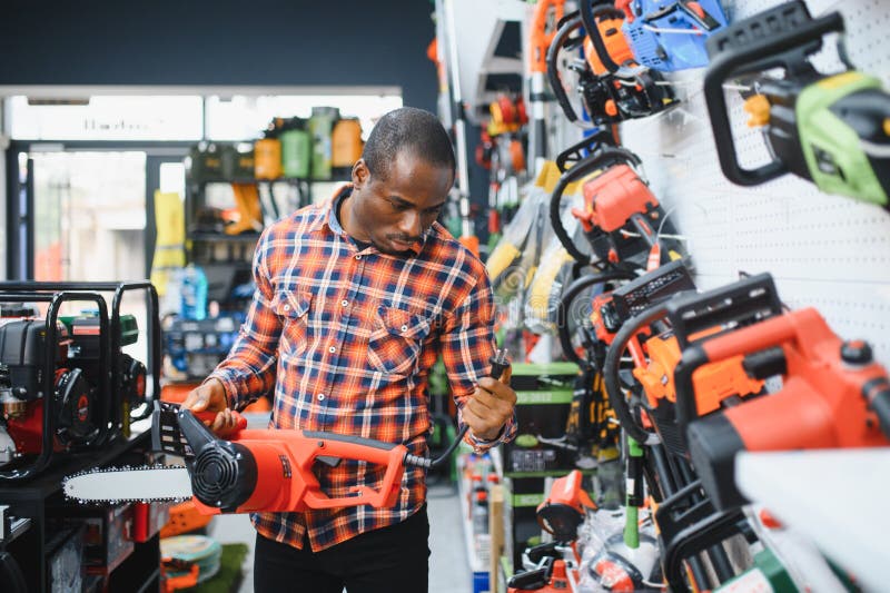 African American Man Choosing Electric Saw Tools Store Stock Photos ...