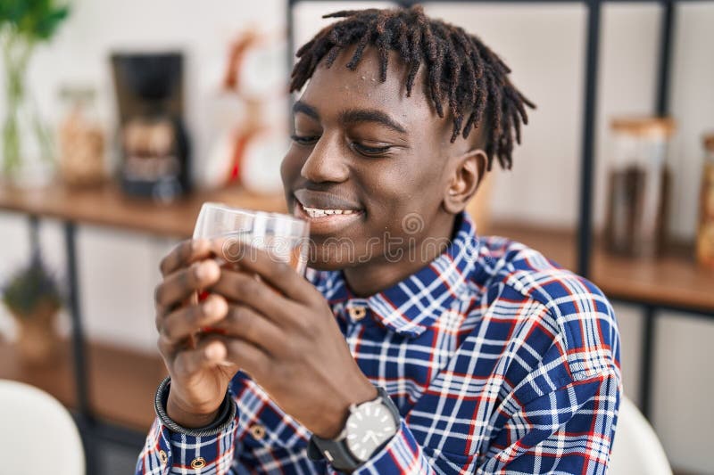 African American Man Drinking Tea Sitting on Table at Home Stock Image ...