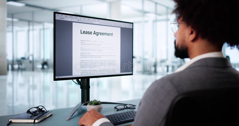 African American Man Examines Lease Agreement Stock Image - Image of ...