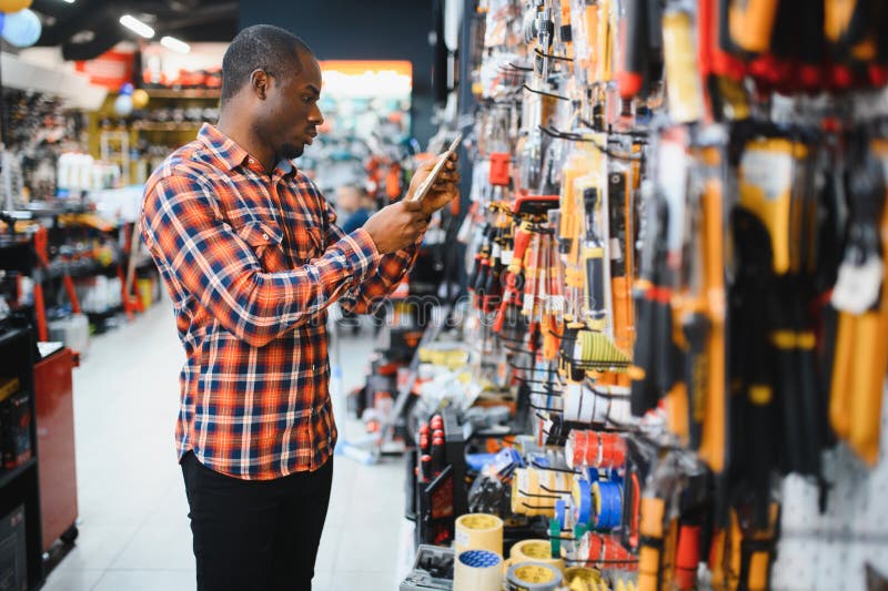 African American Man in a Hardware Store Stock Image - Image of ...
