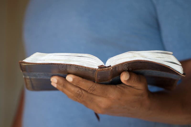 African American Man Holding the Bible Stock Photo - Image of aged ...