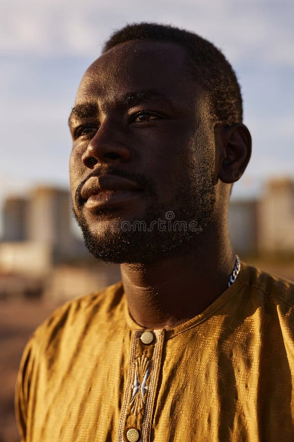 African American Man Sitting on Sand Dune in Desert Stock Image - Image ...