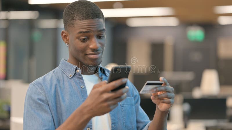 Young African Man Making Online Payment on Smartphone Stock Image ...