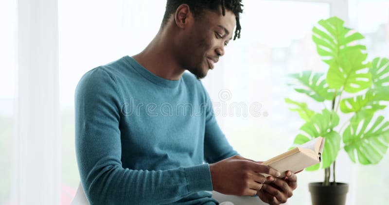 African American Man Reading Book Stock Video - Video of fiction ...