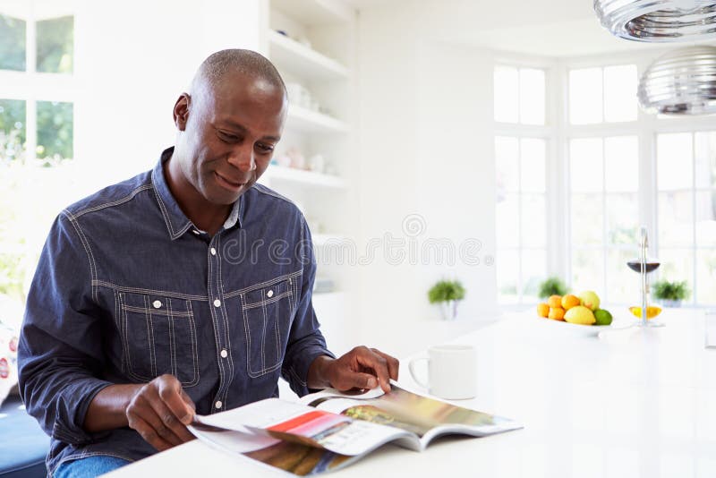 Man Reading A Magazine