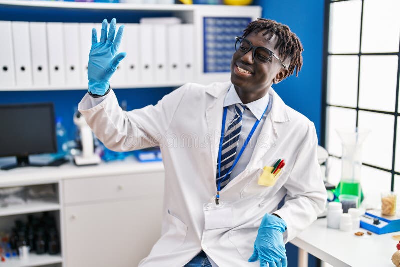 African American Man Scientist Smiling Confident Speaking at Laboratory ...