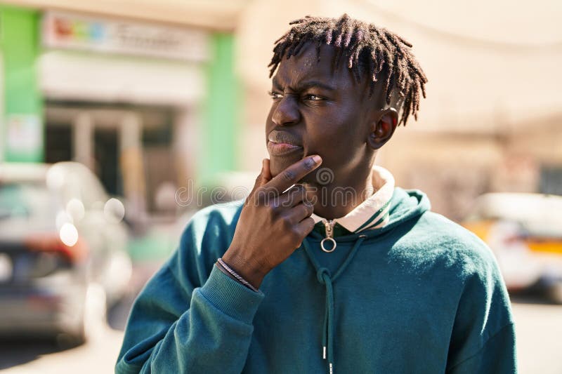 African American Man Standing with Doubt Expression at Street Stock ...