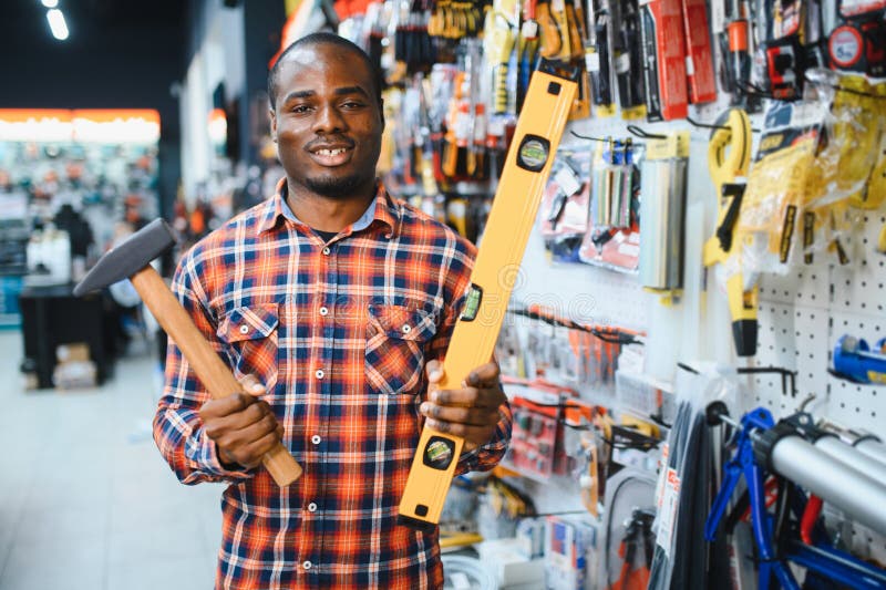 African American Man Standing in Hardware Store Stock Image - Image of ...
