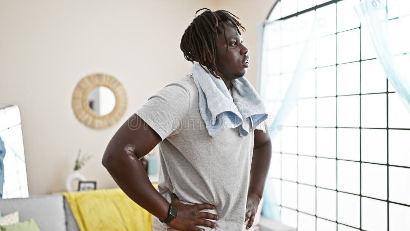 African American Man Standing with Serious Face Sweating at Home Stock ...