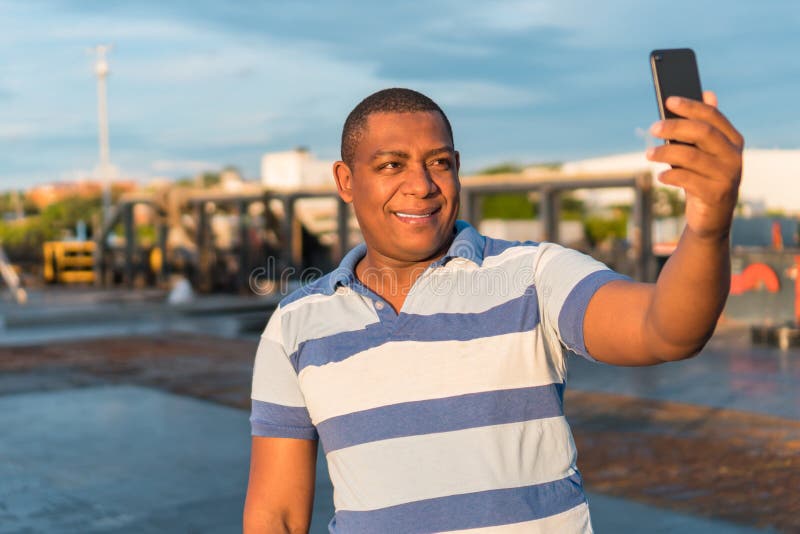 African-American Man Using a Cell Phone Abroad Stock Image - Image of ...