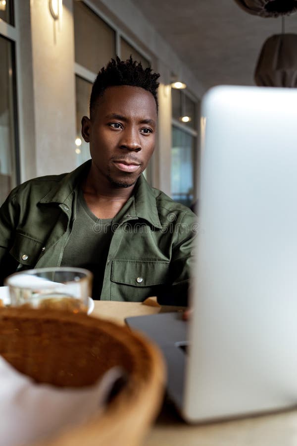 Man In Glasses Sitting With Laptop On Sofa Stock Image - Image of ...