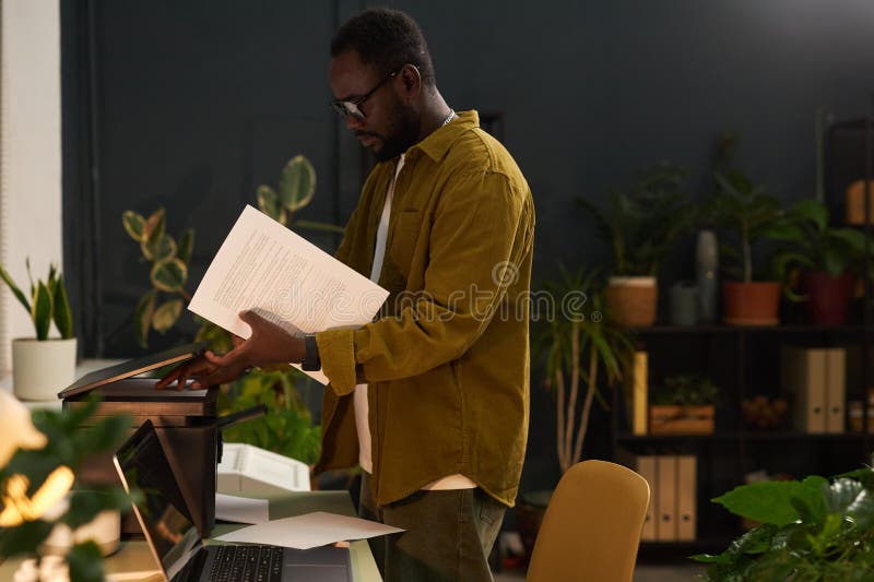 Man Making Copy of Document in Office Stock Photo - Image of paper ...
