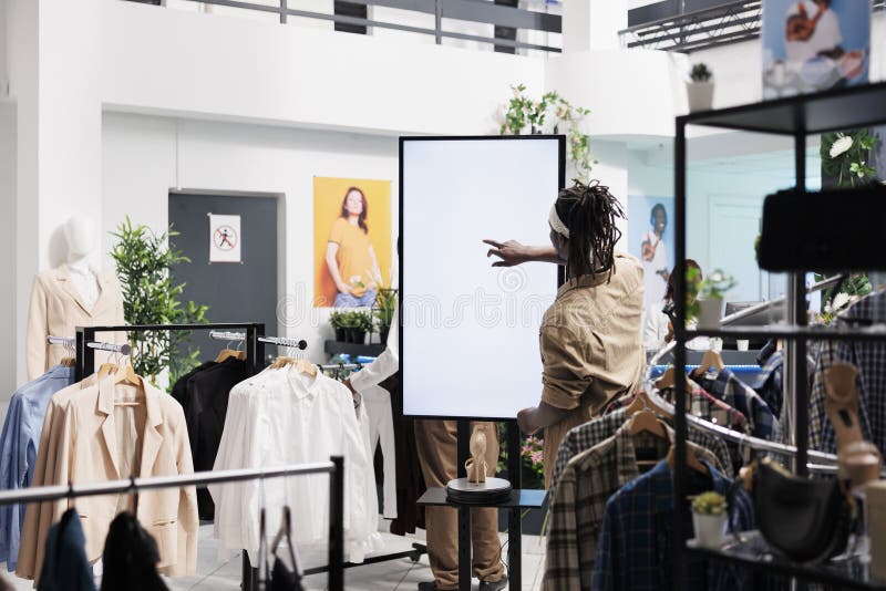 Man Using Smart Interactive Display Board in Clothing Store Stock Photo ...