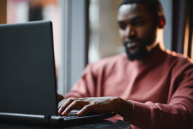African American Man Working on Laptop in a Cafe. Stock Photo - Image of laptop, stylish: 244811522