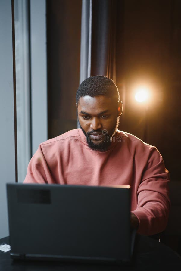 African American Man Working on Laptop in a Cafe. Stock Photo - Image ...
