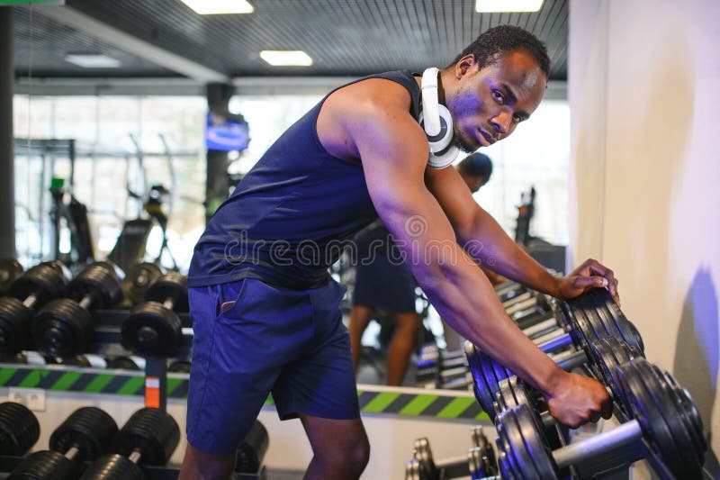 African American Man Working Out in the Gym. Stock Image - Image of ...