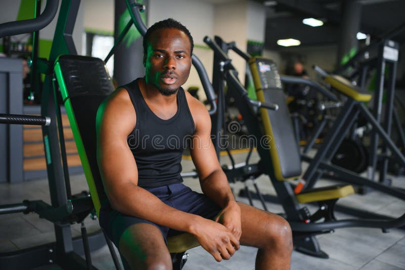 African American Man Working Out in the Gym. Stock Image - Image of ...
