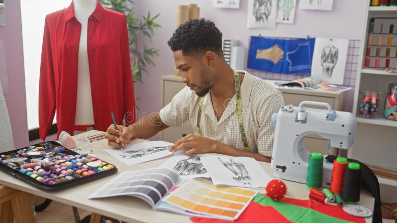African American Man Working in Tailor Shop with Sewing Machine, Fabric ...