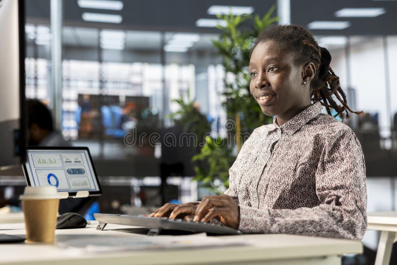 African American Manager Analyzing Company Data for Strategic Planning ...