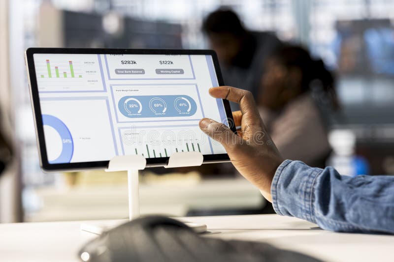 African American Manager Analyzing Company Data for Strategic Planning ...