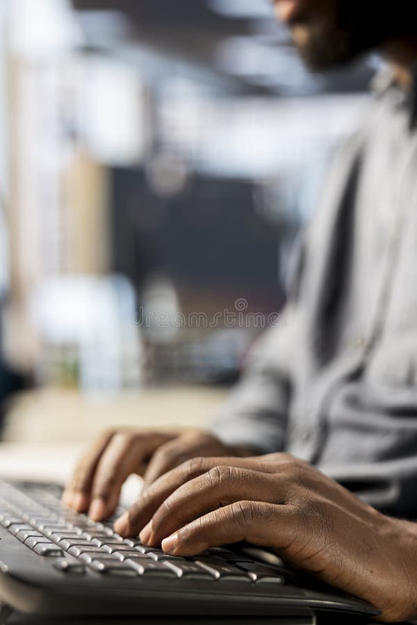 African American Manager Analyzing Company Data for Strategic Planning ...