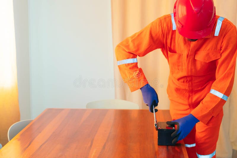 African American Mechanic Working on a House Stock Image - Image of ...