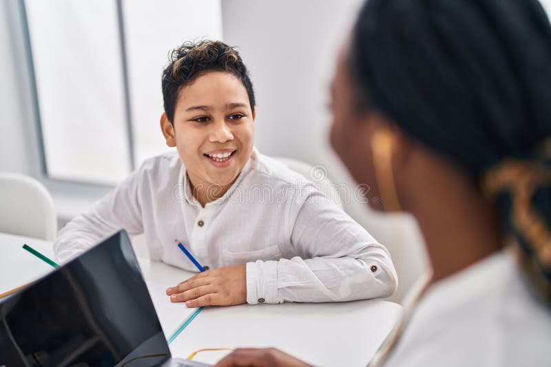 African American Mother and Son Teleworking and Studying at Home Stock ...