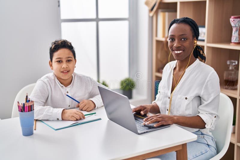 African American Mother and Son Teleworking and Studying at Home Stock ...