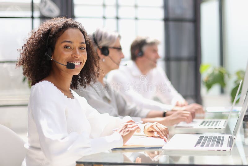 African American Operator Smiling in a Call Center Stock Photo - Image ...