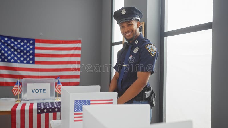 African American Policeman Smiling in a Voting Center with Us Flags ...