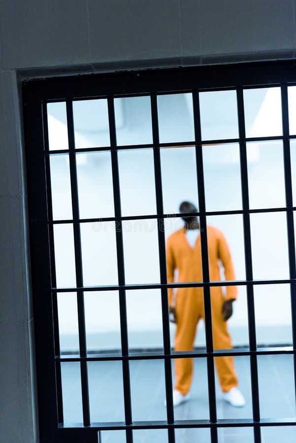 A Prisoner Standing Behind an Iron Door with a Hole for Supplying Food ... A Prisoner Standing Behind an Iron Door with a Hole for Supplying Food ...