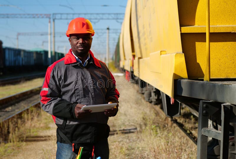 Railway Employee Holds in Hands Tablet Pc and Look at the Camera Stock ...