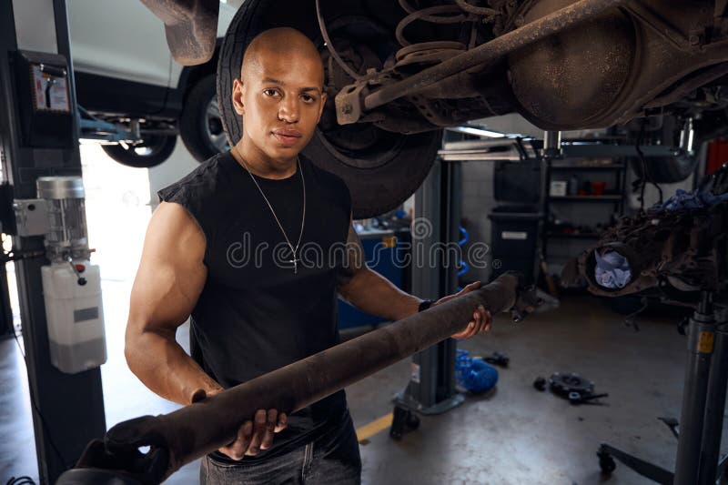 African American Repairman Removing Drive Shaft Stock Photo - Image of ... African American Repairman Removing Drive Shaft Stock Photo - Image of ...