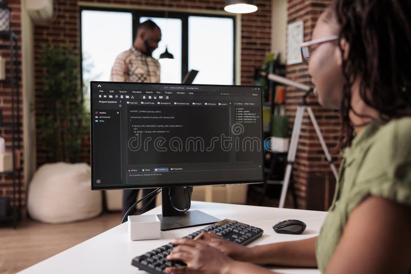 African American Software Developer Debugging Source Code Algorithm Looking At Computer Screen