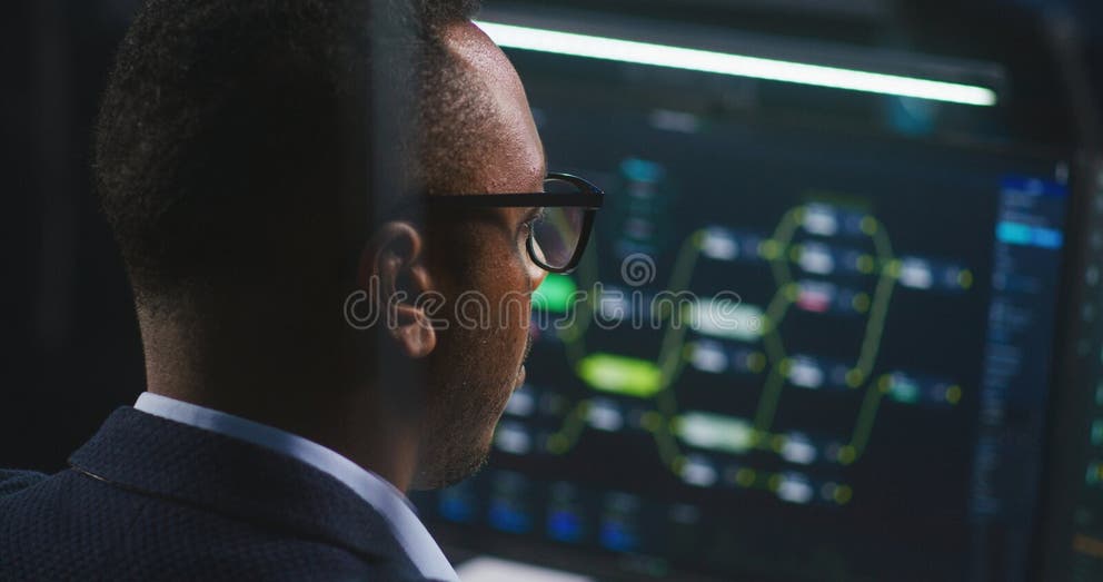 African American Software Engineer Looks at Computer Screen Stock Image ...