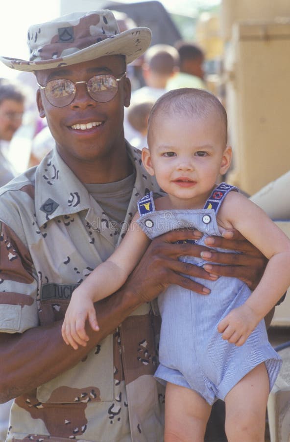 African-American Soldier Holding Baby Editorial Image - Image of parade ...