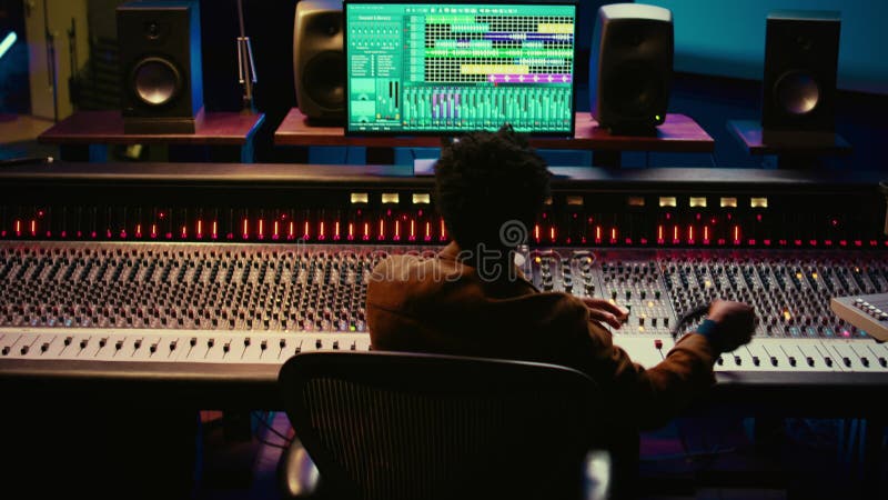 African American Sound Engineer Recording and Editing Tracks in Post ...