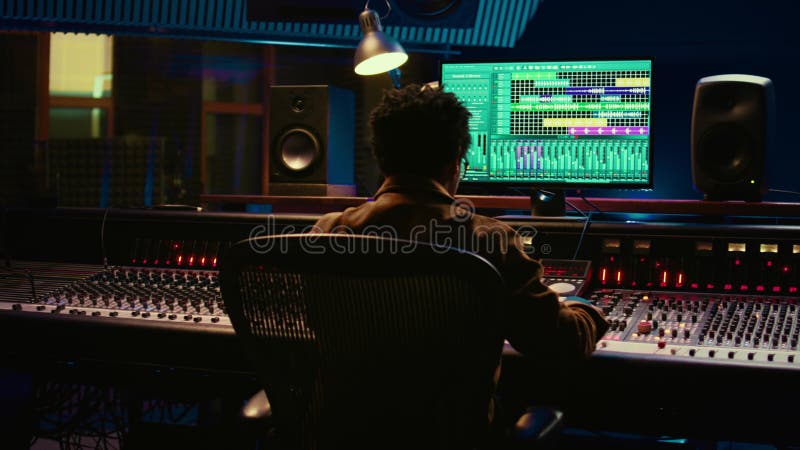 African American Sound Producer Editing Tracks on Audio Software and ...