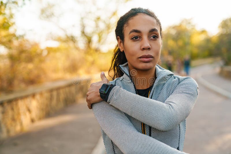 African American Sportswoman Doing Exercise while Working Out Stock ...