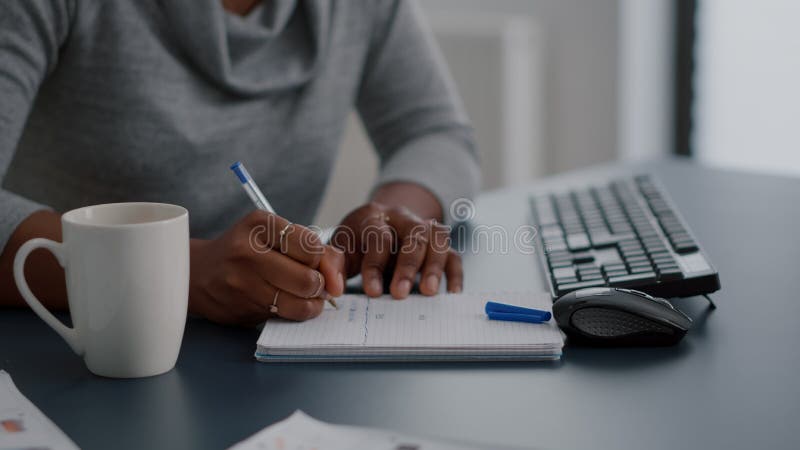 African American Student Writing High School Homework on Notebook ...
