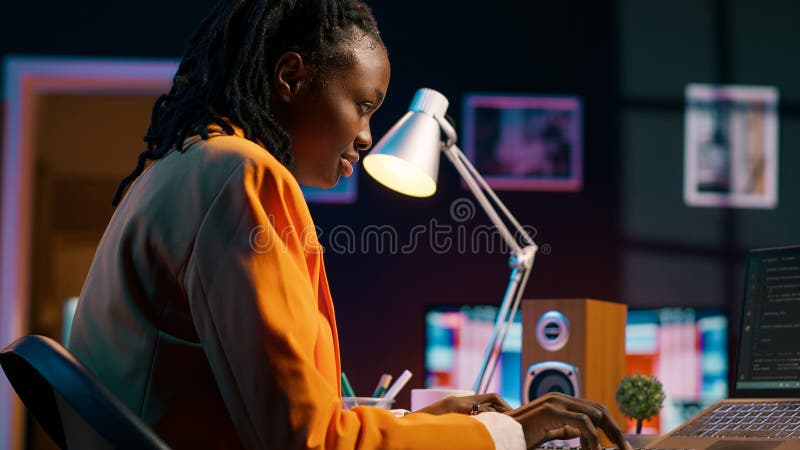 African American System Engineer Using Ai System To Write Computer Program Code Stock Image