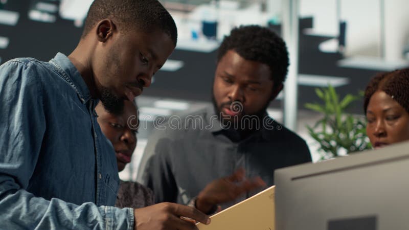 African American Team Collaborates on a Financial Project in a Business ...