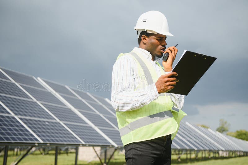 African American Technician Check the Maintenance of the Solar Panels ...