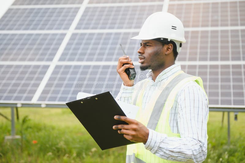 African American Technician Check the Maintenance of the Solar Panels ...
