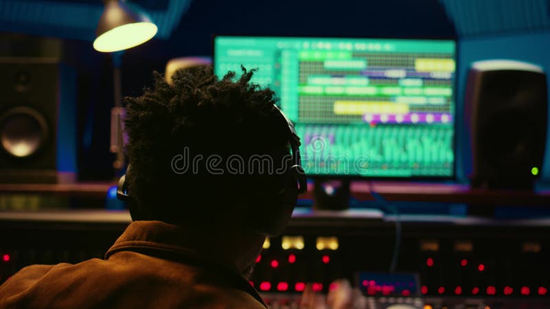 African American Tracking Engineer Processing and Mixing Sounds in ...