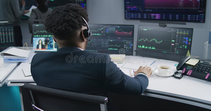 African American Trader Analyzes Market Charts Stock Photo - Image of ...